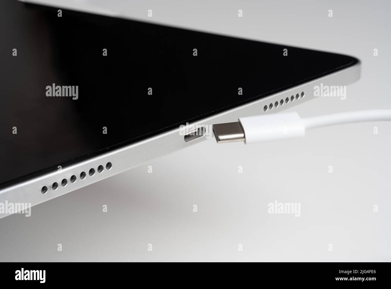 still life. Studio shot of a digital tablet with a usb-c cable Stock ...