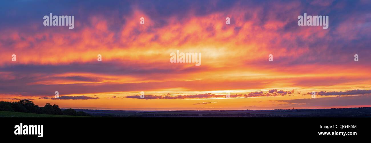 Landscape view to the sun and clouds over farming green fields Stock ...