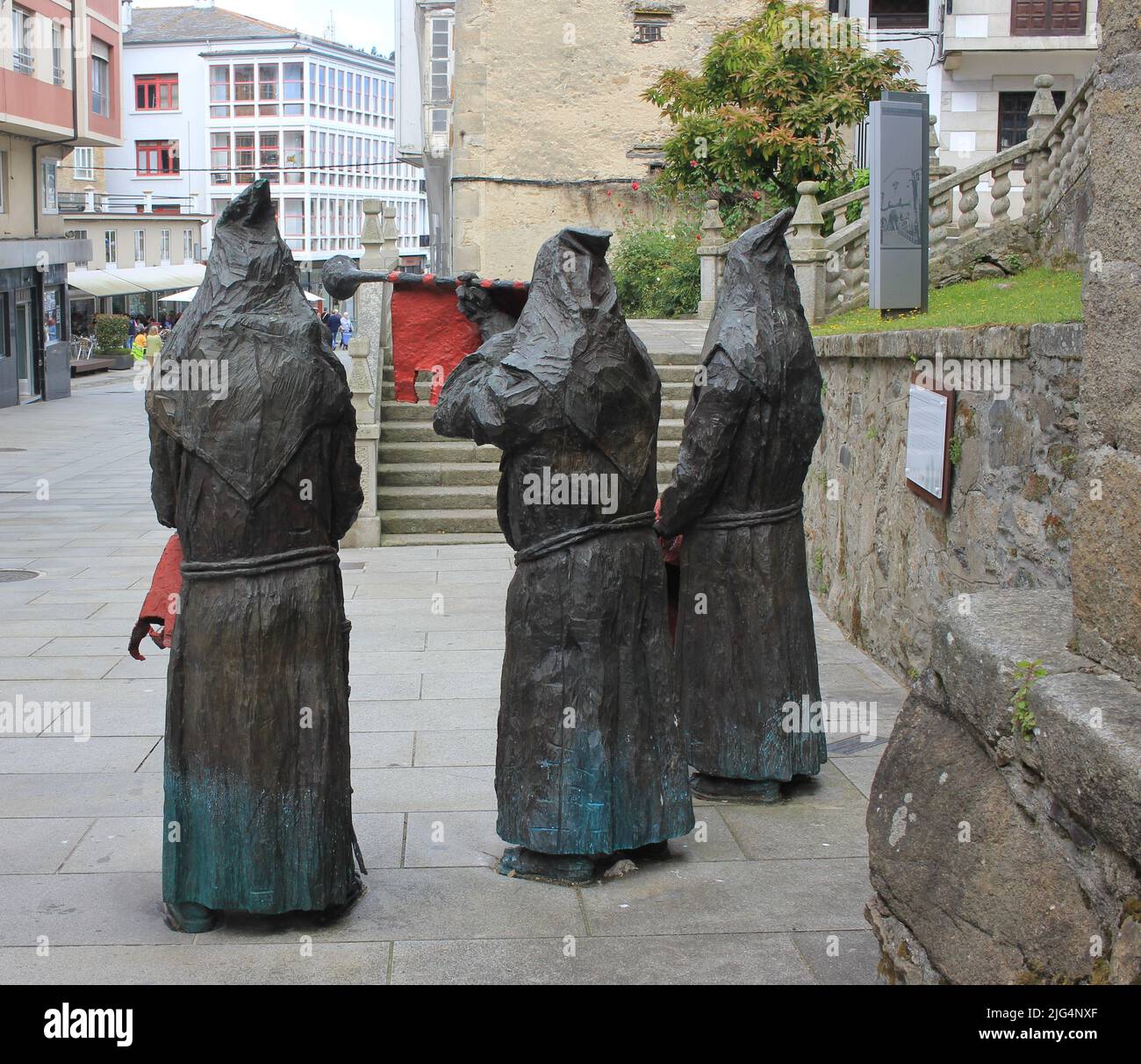 sculpture of three monks in front of a church in Viveiro, Spain Stock ...