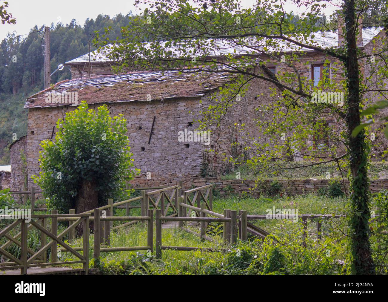 old, stone houses close to a river in the countryside Stock Photo - Alamy