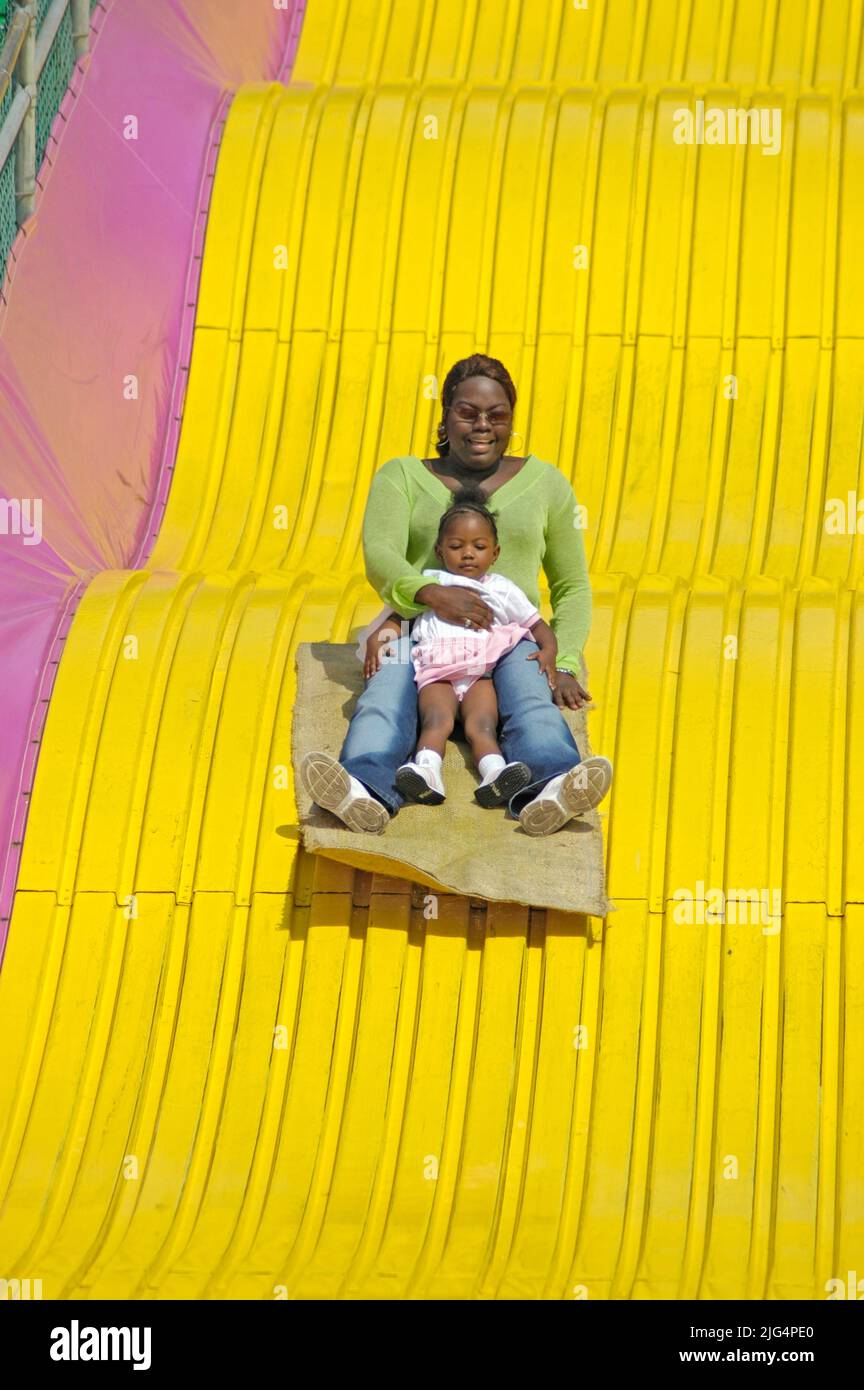 People on local carnival rides for fun during summer vacations at ...