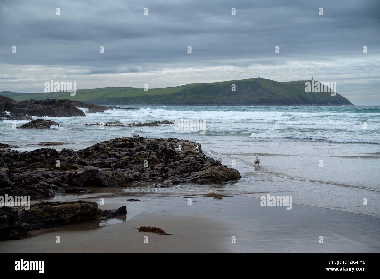 Polzeath beach, popular with surfers, under a moody sky, Cornwall,UK ...