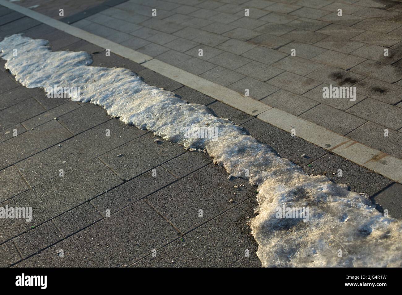 Ice melting into water on the road hi-res stock photography and images ...
