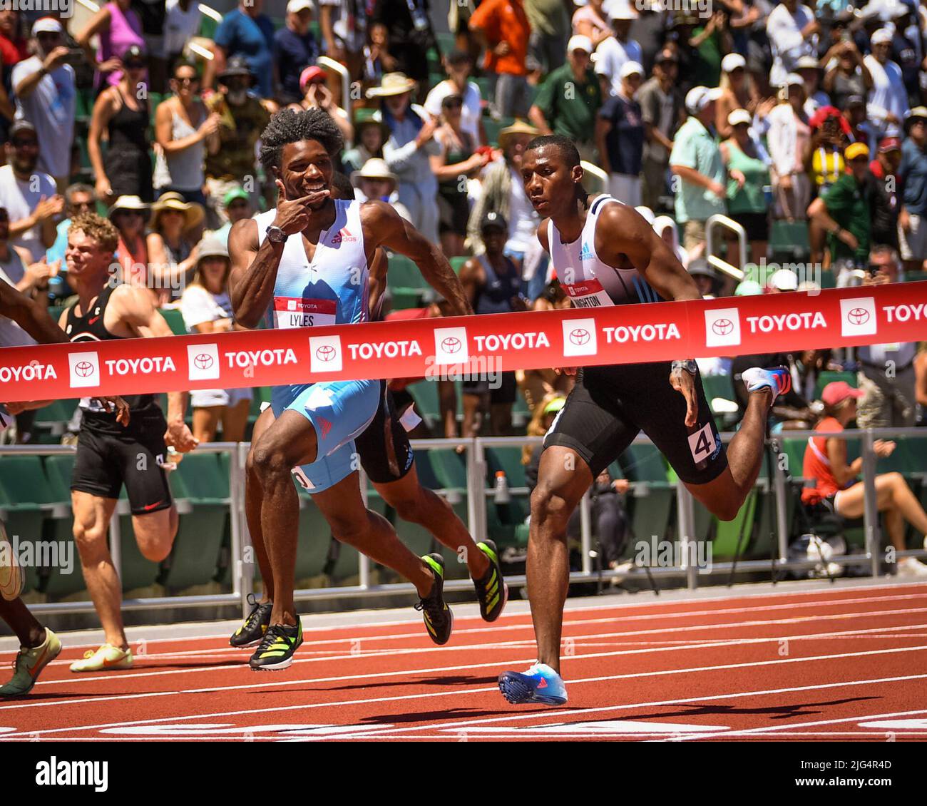 Noah Lyles points at Erriyon Knighton as they cross the finish line in the Toyota men’s 200m ...