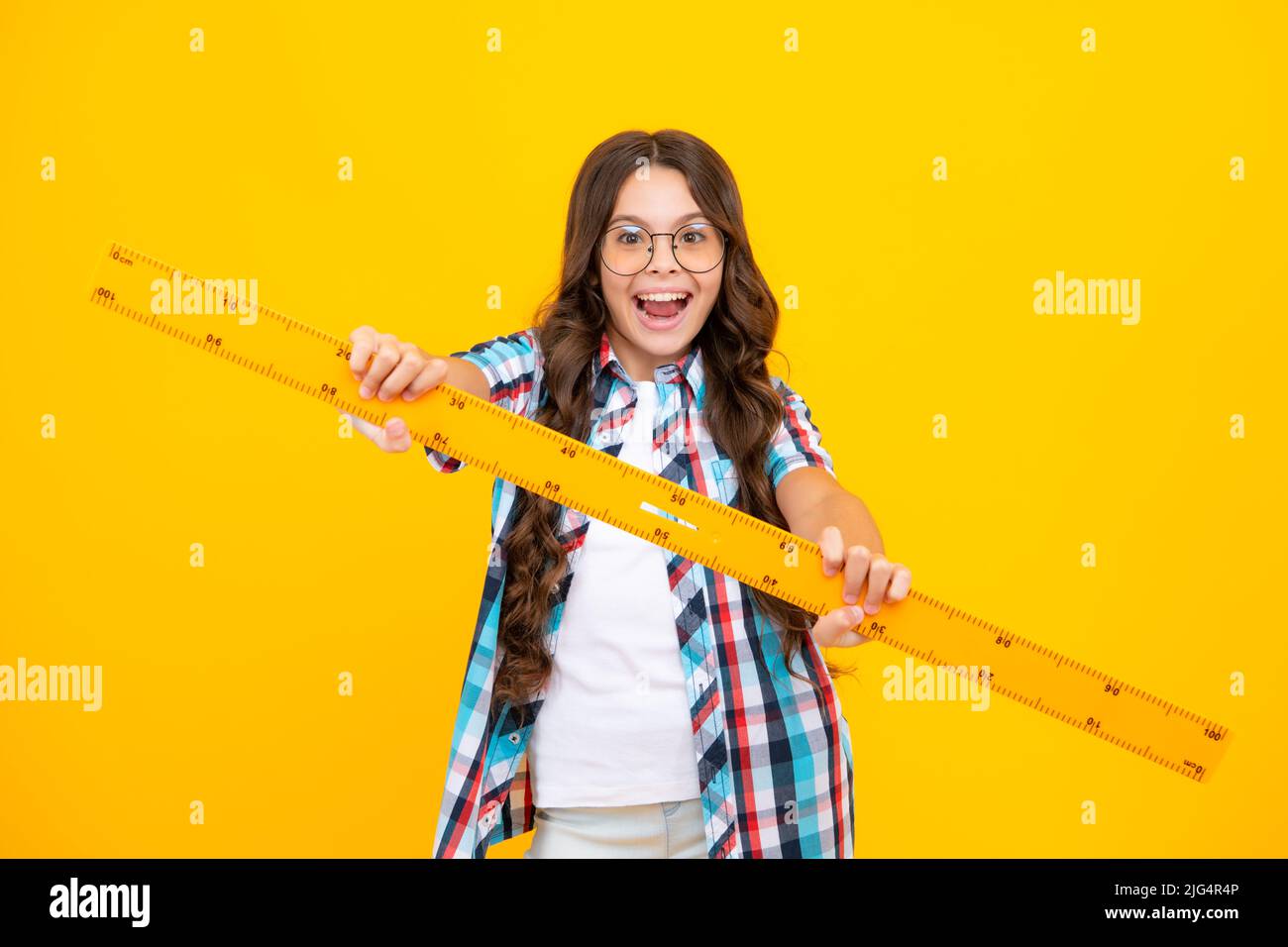 Teenager school girl study math or geometry lesson, measure the size ...
