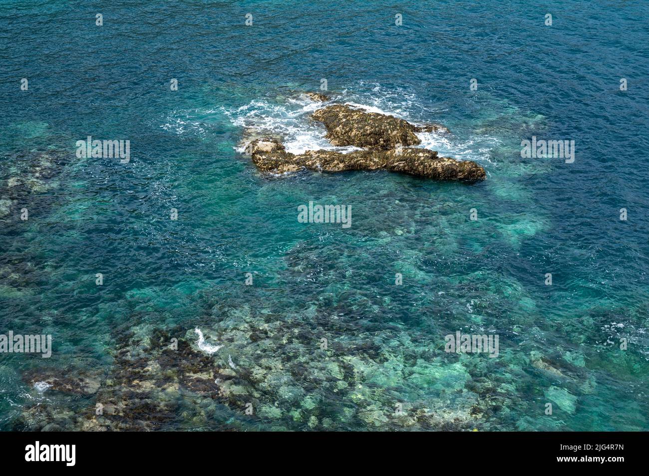 The coastal rocks and clear blue green water near Port Isaac, Cornwall ...