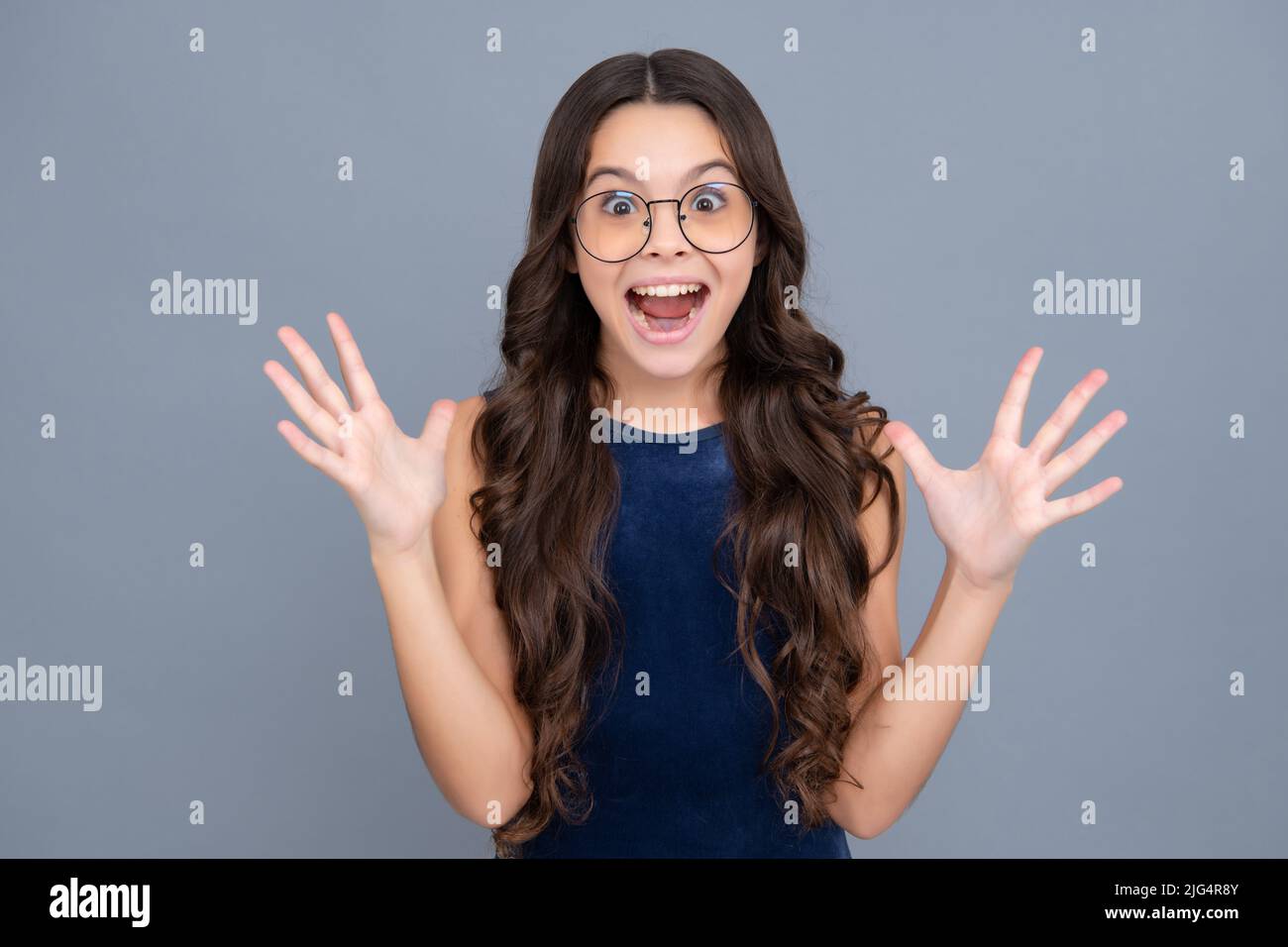 Portrait of emotional positive teenage child girl shouting in amazement ...