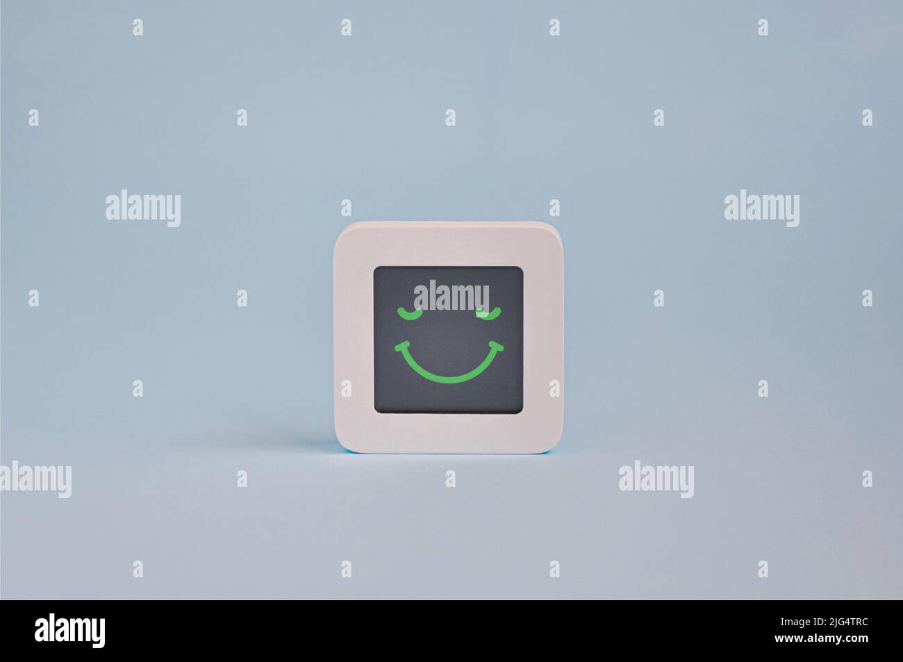Happy emotion concept, symbol of smiley emoticon on lcd display ...