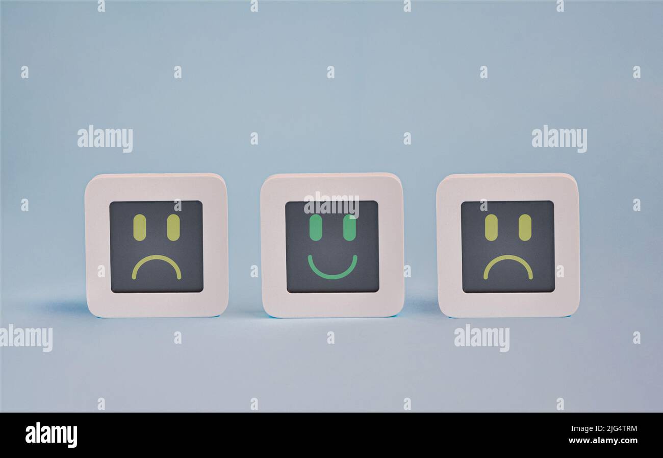 Set of computers with stylized faces of happy and sad faces on lcd ...