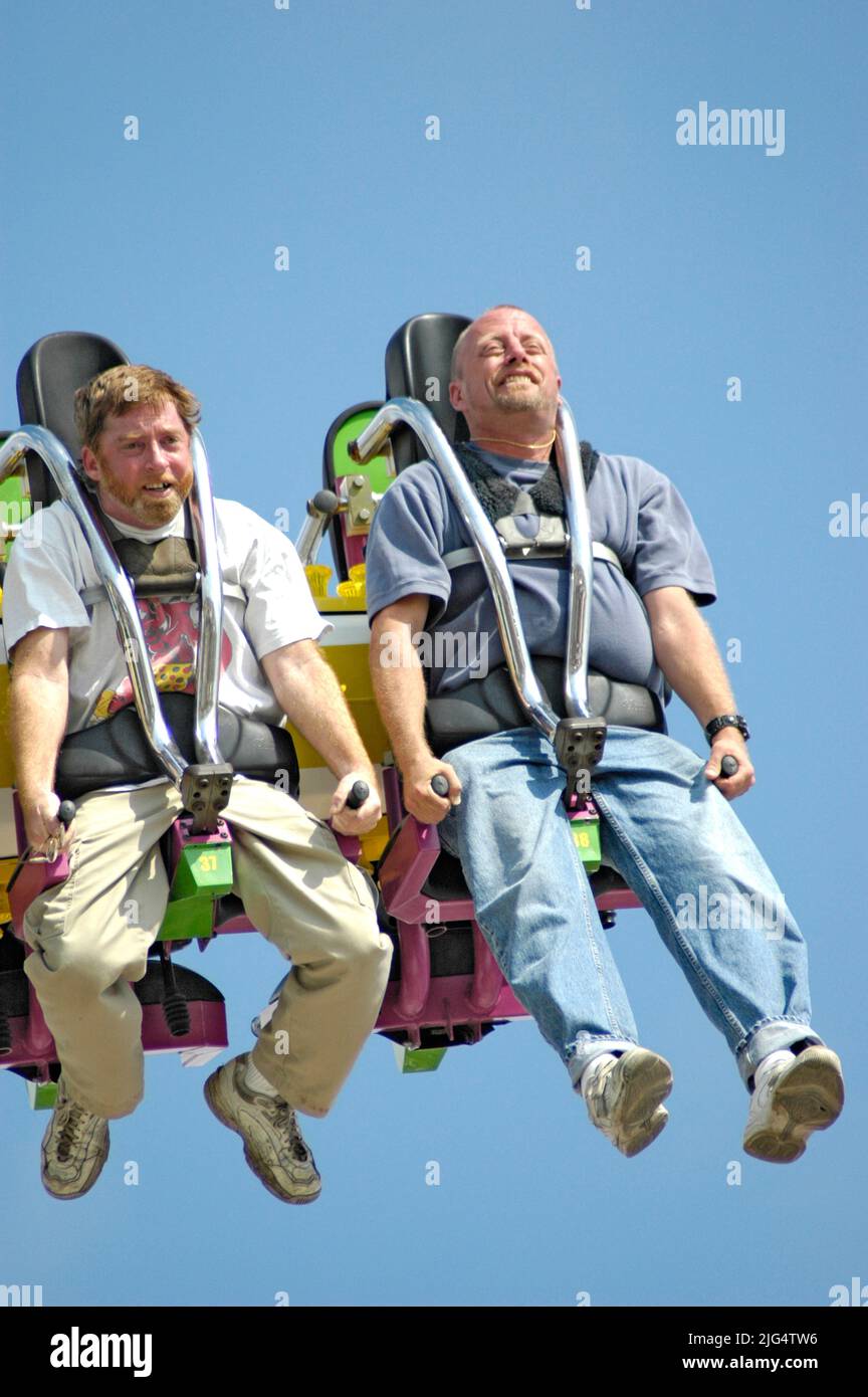 People on local carnival rides for fun during summer vacations at ...