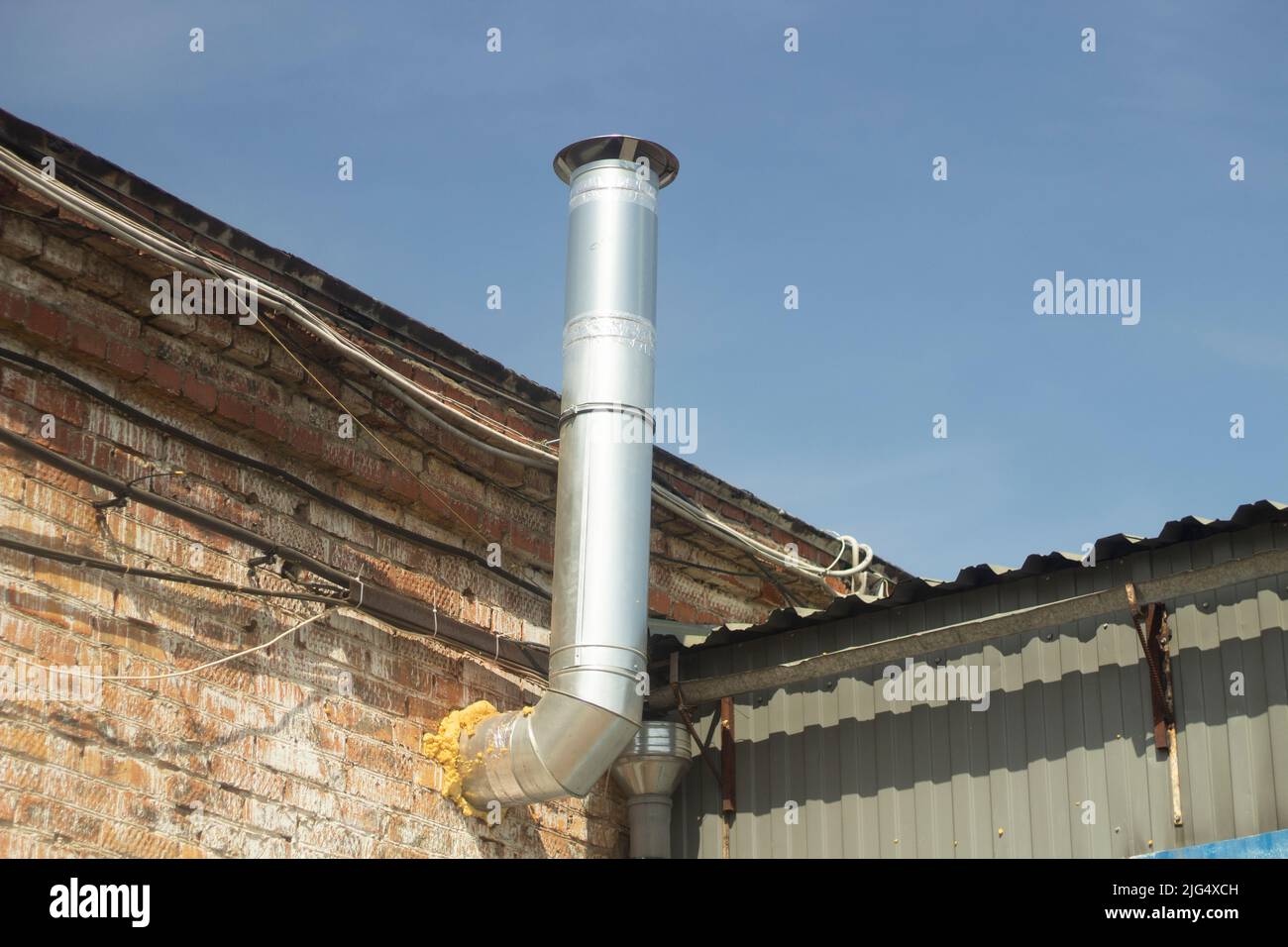 Pipe on roof. Steel pipe for smoke. Details of industrial building ...