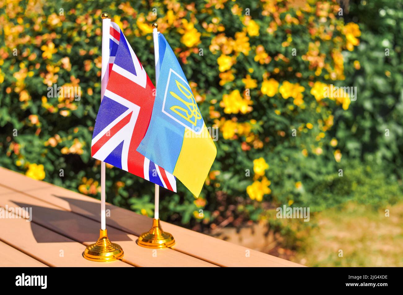 Ukrainian and british flags in the blue sky close up Stock Photo - Alamy