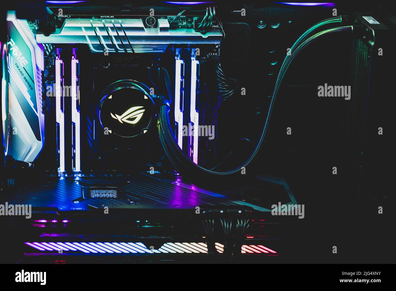 A high end gaming computer is illuminated with rainbow colors. All ...