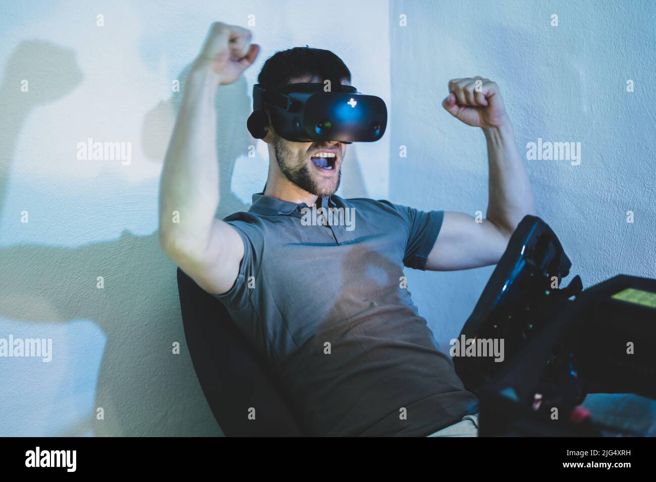 A gamer is having fun with a high end simracing rack Stock Photo - Alamy