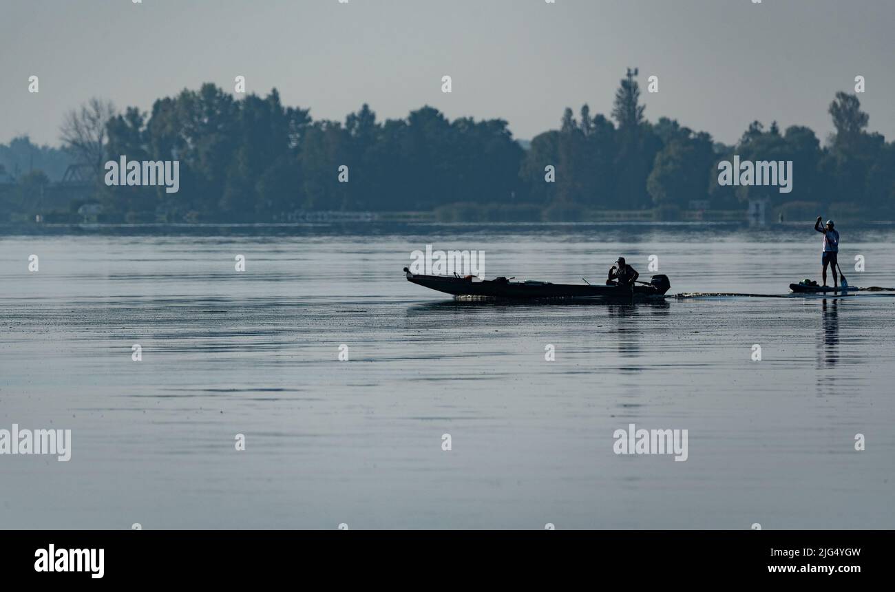 Zegrze, Poland - September 8, 2021: Angler in a boat with an internal ...