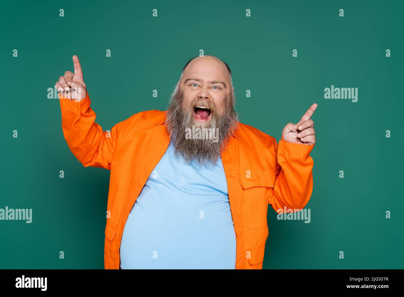 thrilled overweight man screaming and pointing up with fingers isolated ...