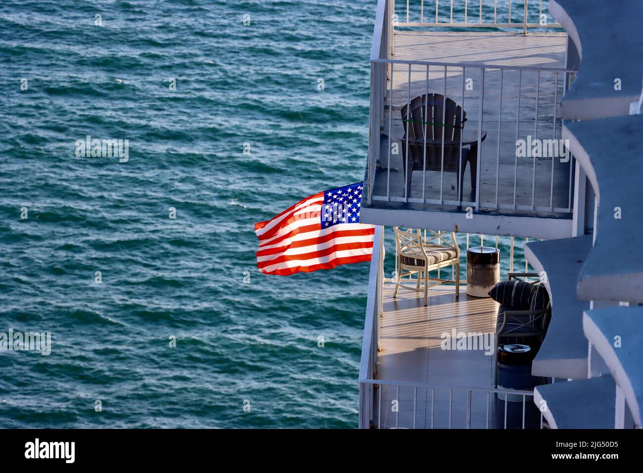 American flags in the wind from balconies over Lake Erie in Lakewood ...