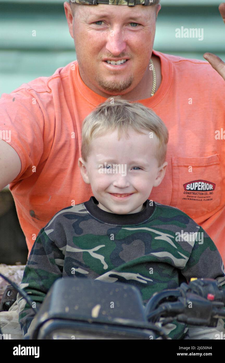 People with 4 wheelers and trucks on Sunday outing in the mud for fun ...