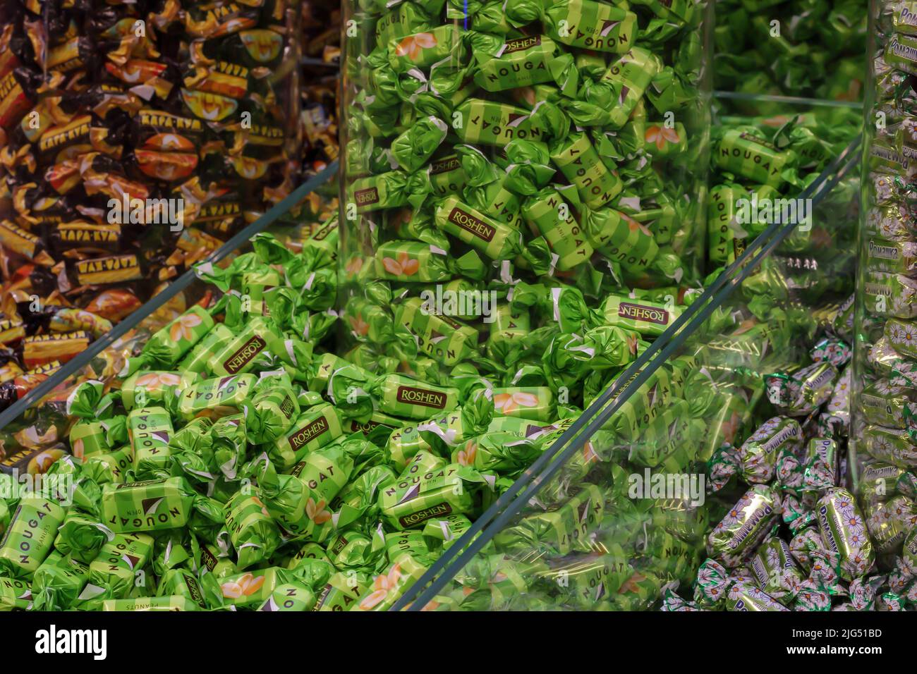 Lots of sweet bright chocolates named Kara-kum, nougat, chamomile on ...