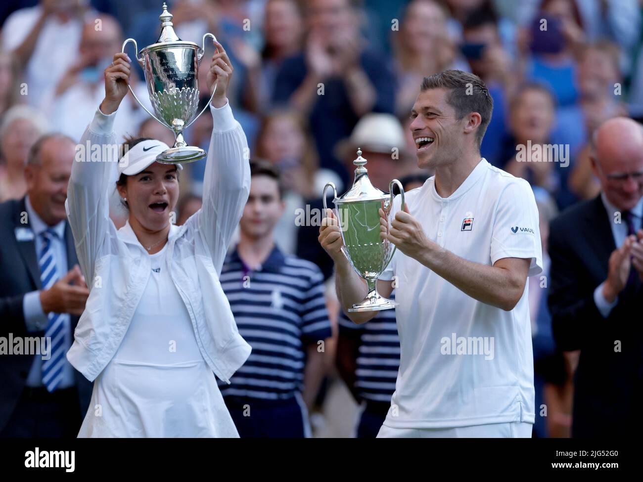 Neal Skupsk and Desirae Krawczyk celebrate with their trophies after ...