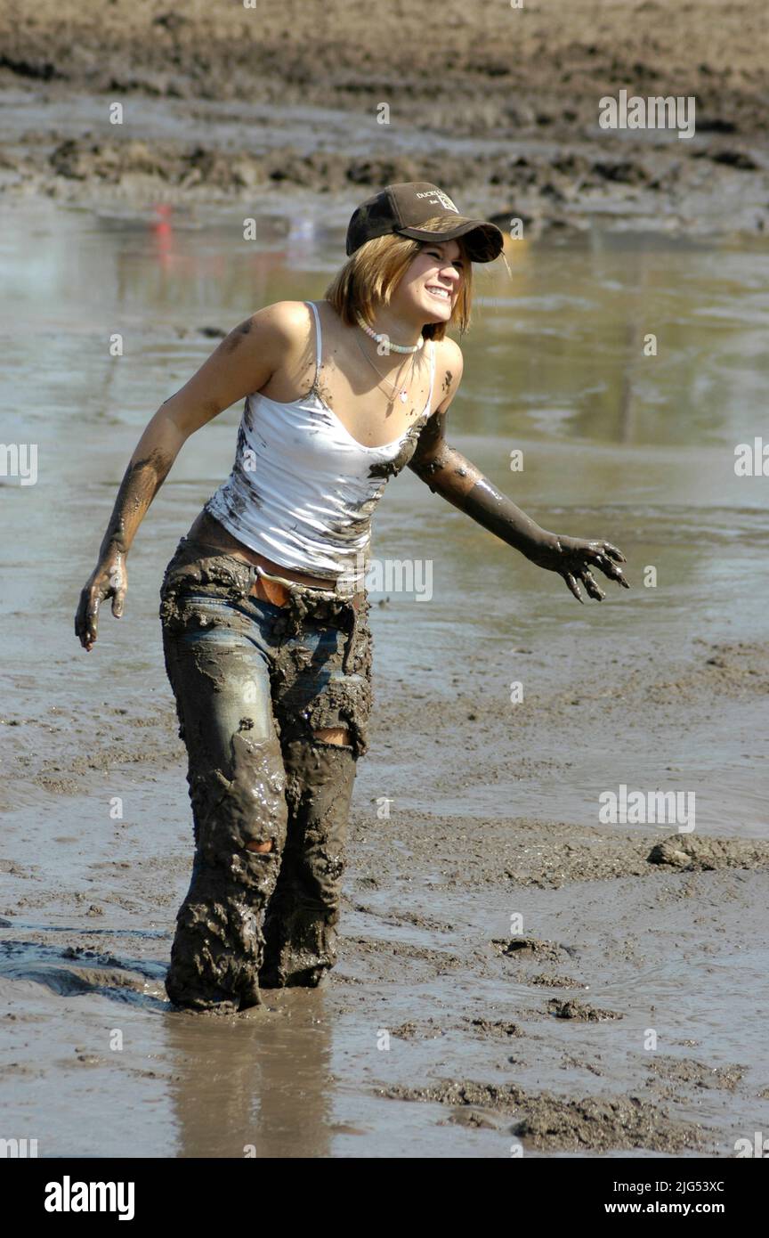 mid-teen girl People with 4 wheelers and trucks on Sunday outing in the ...