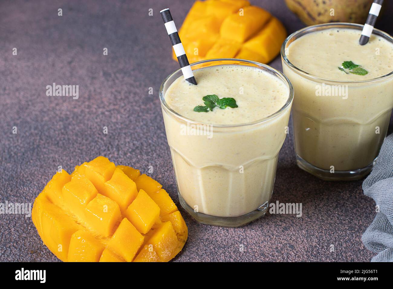 Mango lassi in glasses on brown background. Freshness indian lassi made ...