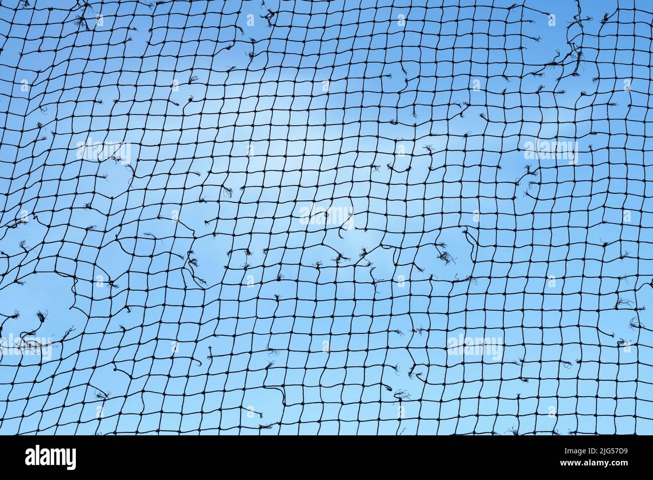 Torn Driving range net at a Golf Course Stock Photo - Alamy