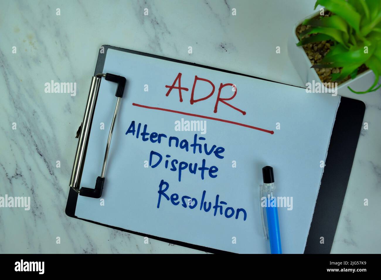 Concept of ADR - Alternative Dispute Resolution write on a paperwork ...