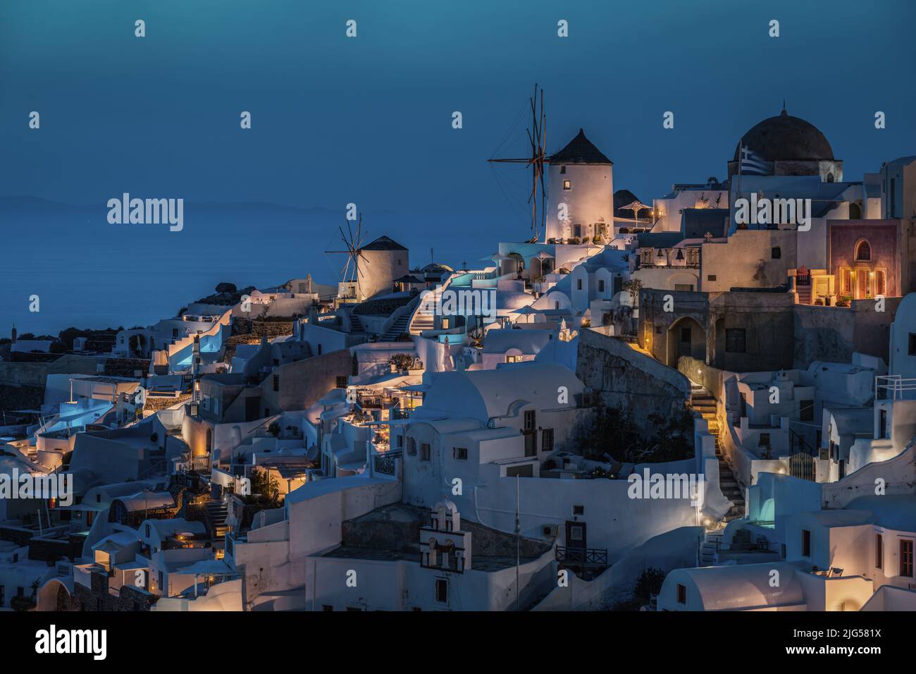 Scenic blue hour at Oia, the most typical village of Santorini and ...