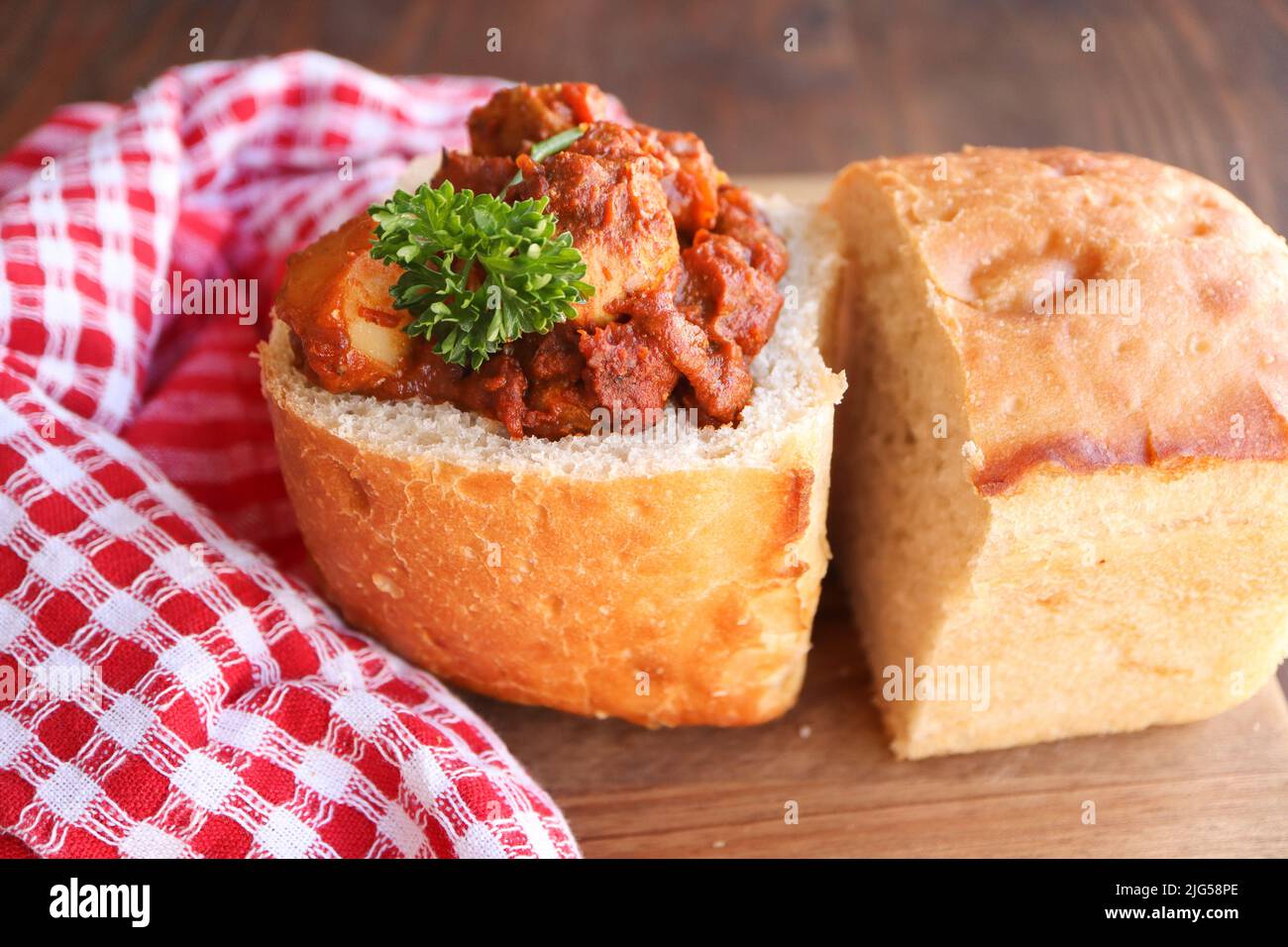 Traditional South African cuisine. Bunny chow filled with curry ...