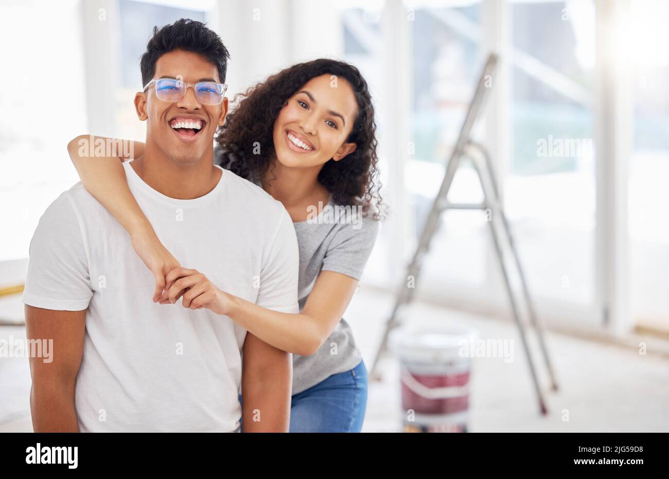 We built a home from the ground up. Shot of a young couple standing ...