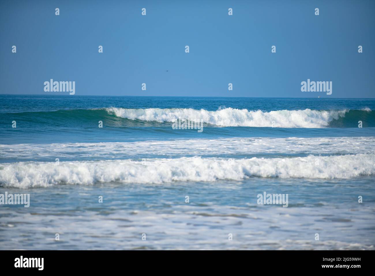 Summer beach, ocean waves on a tropical sea with deep blue wawes. Calm ...