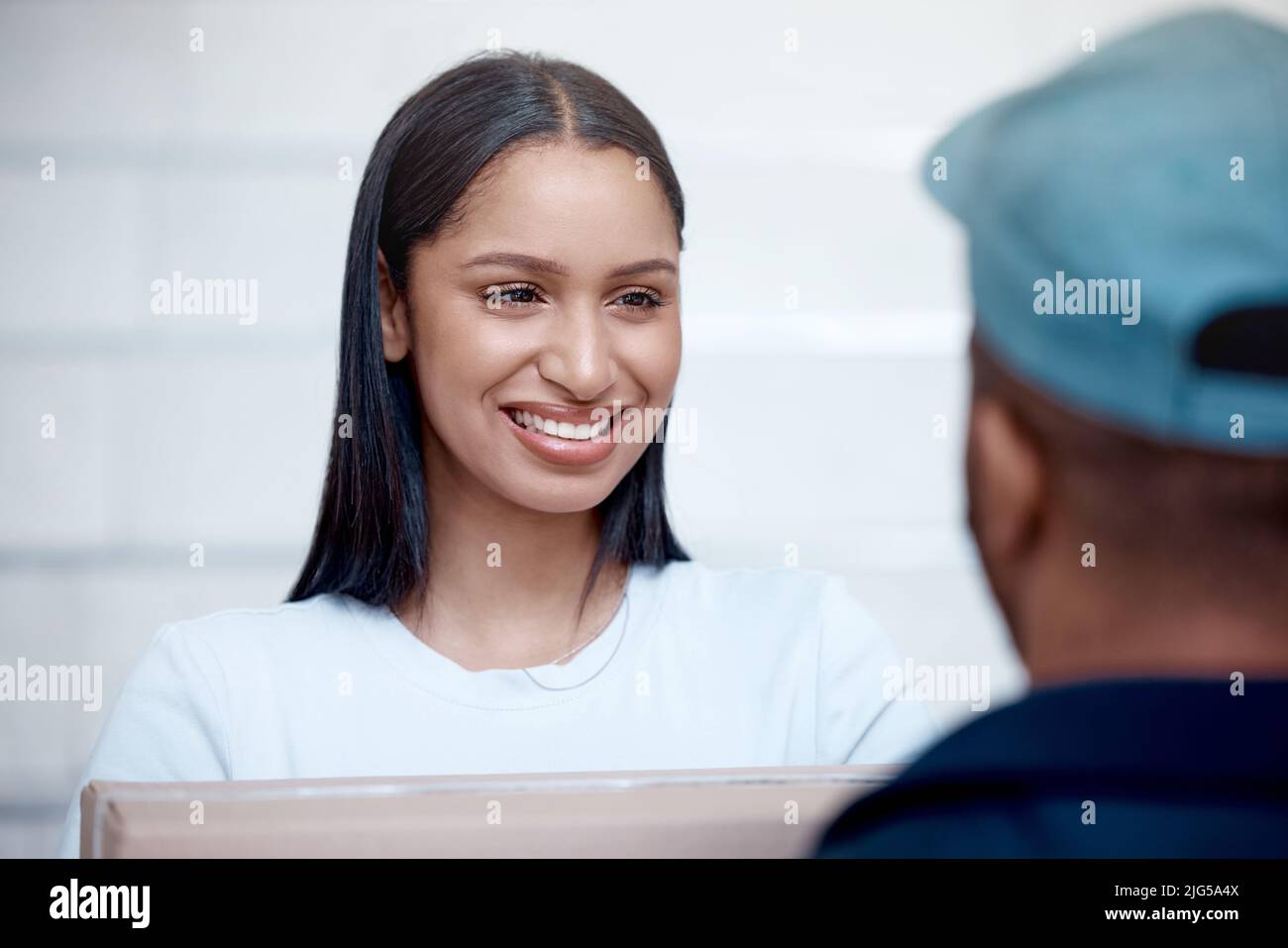 That happy moment when your parcel is finally delivered. Shot of a ...