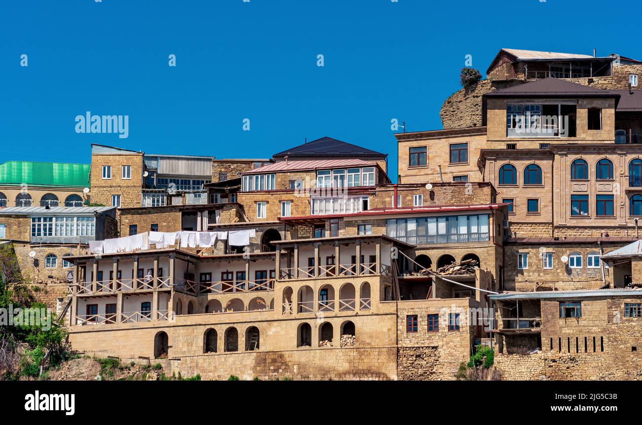 facades of houses located in tiers on a steep slope in the village of ...