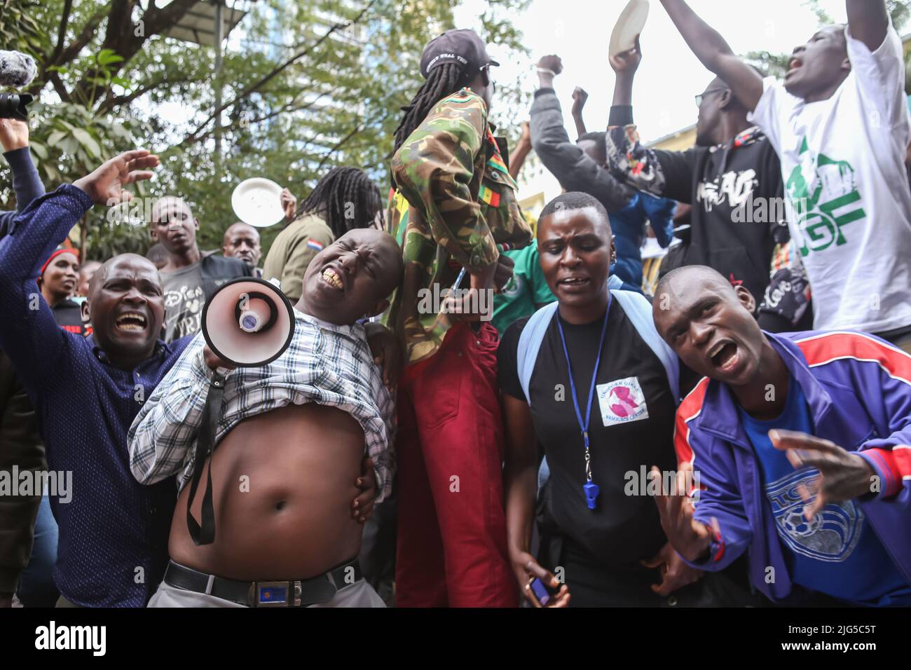 Kenyans shout slogans during a march against the high cost of living on ...