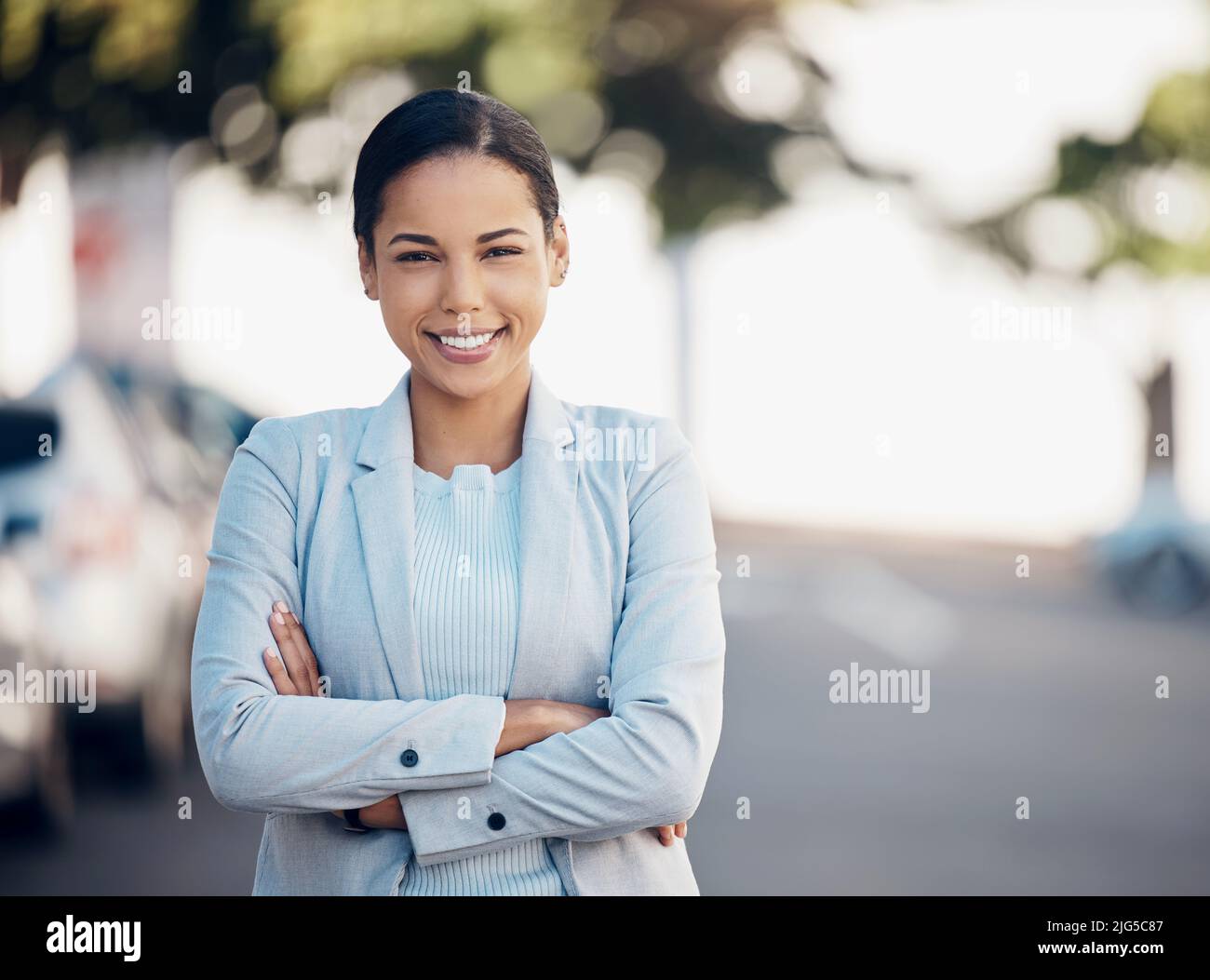 Strong mind, strong posture. Shot of a young woman folding her arms ...
