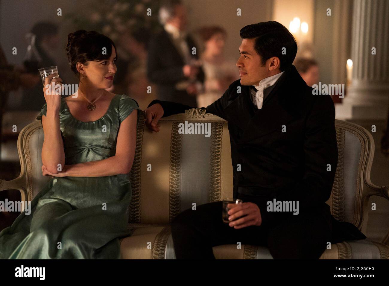PERSUASION, from left: Dakota Johnson, as Anne Elliot, Henry Golding, as Mr. Elliot, 2022. ph ...