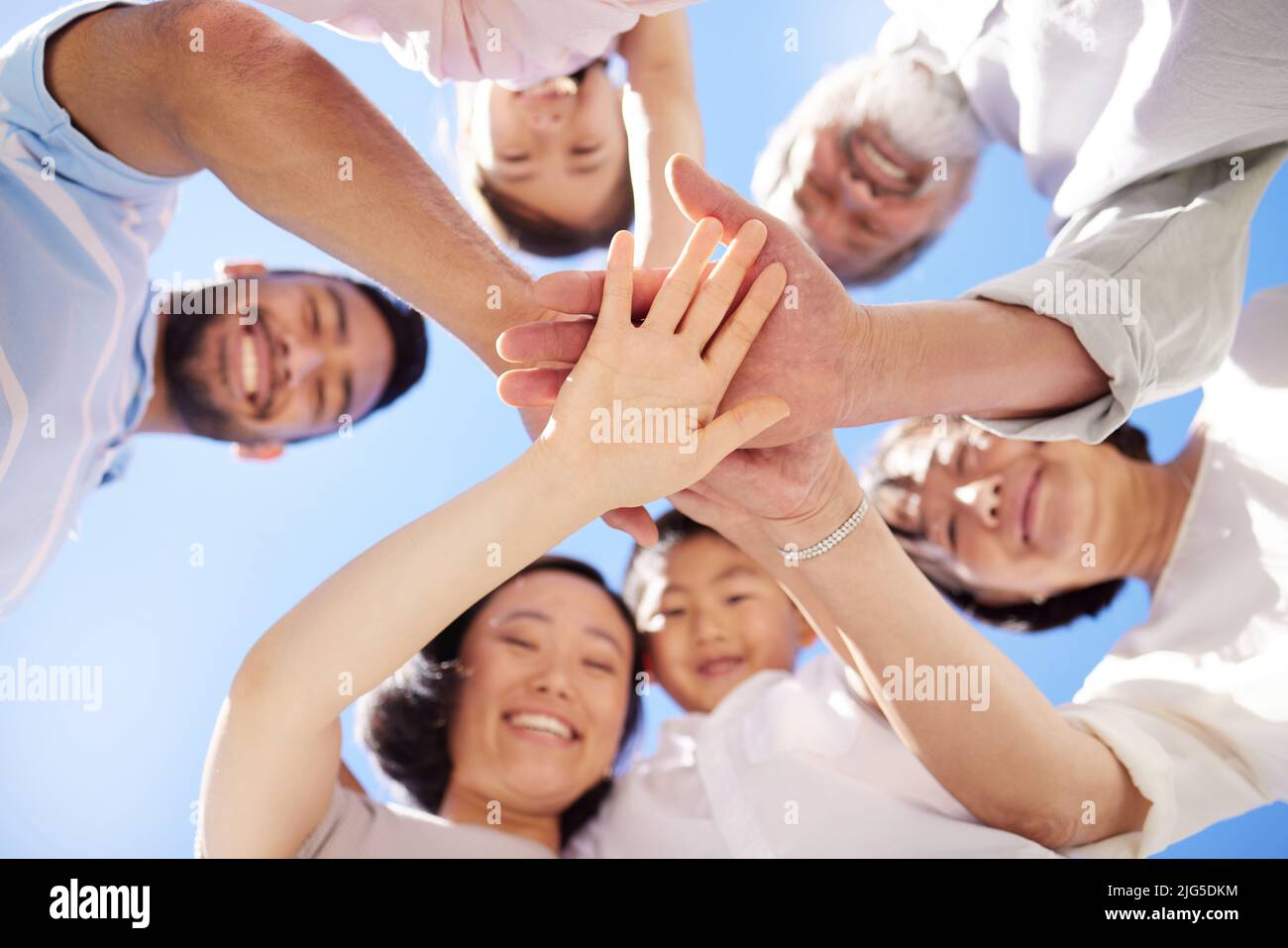 Weve got the family spirit. Shot of a family stacking their hands ...