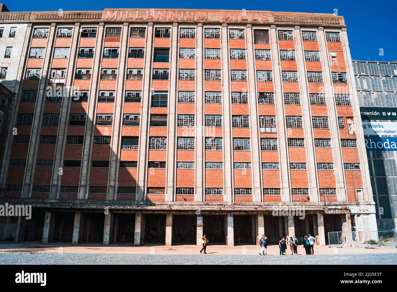 Millennium Mills facade, a derelict flour mill on the Royal Docks in ...
