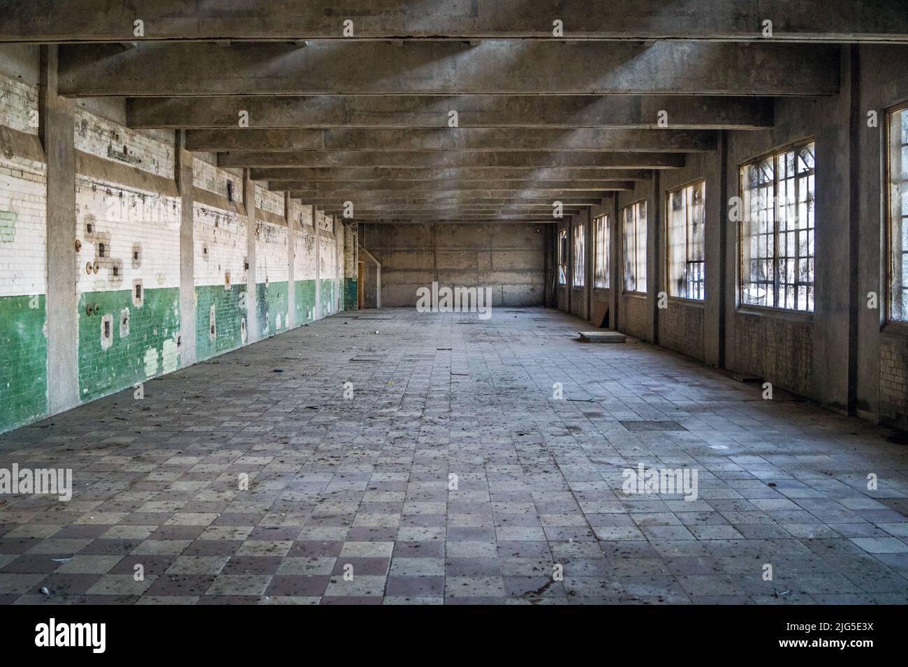 Empty room inside derelict building Millennium Mills, an old flour mill ...