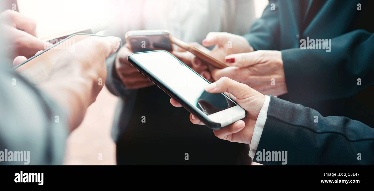 Part of a bigger network. High angle shot of a group of unrecognisable ...
