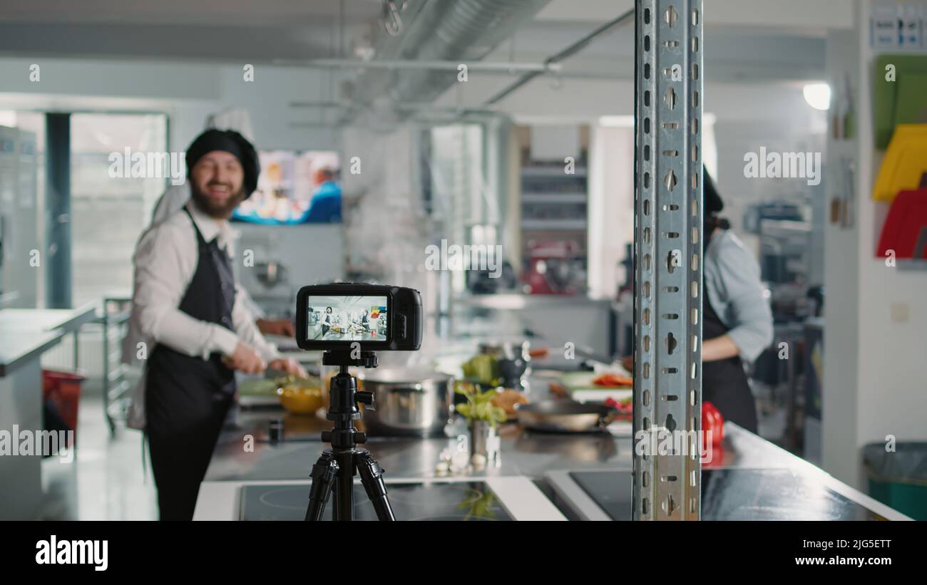 Professional camera recording cooking show content with chefs in ...