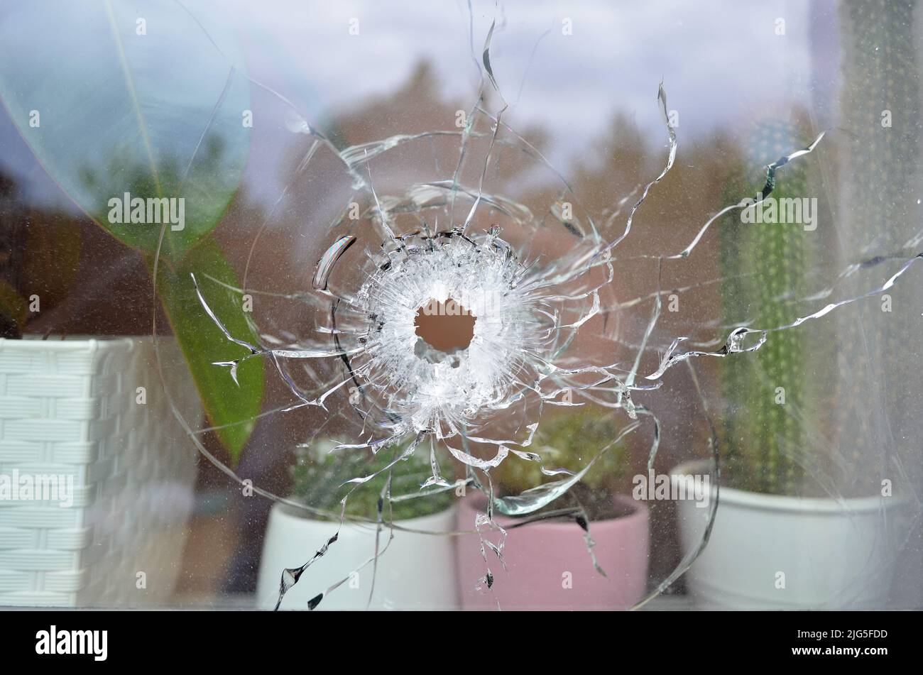 Broken window of a private house as a result of active hostilities in ...