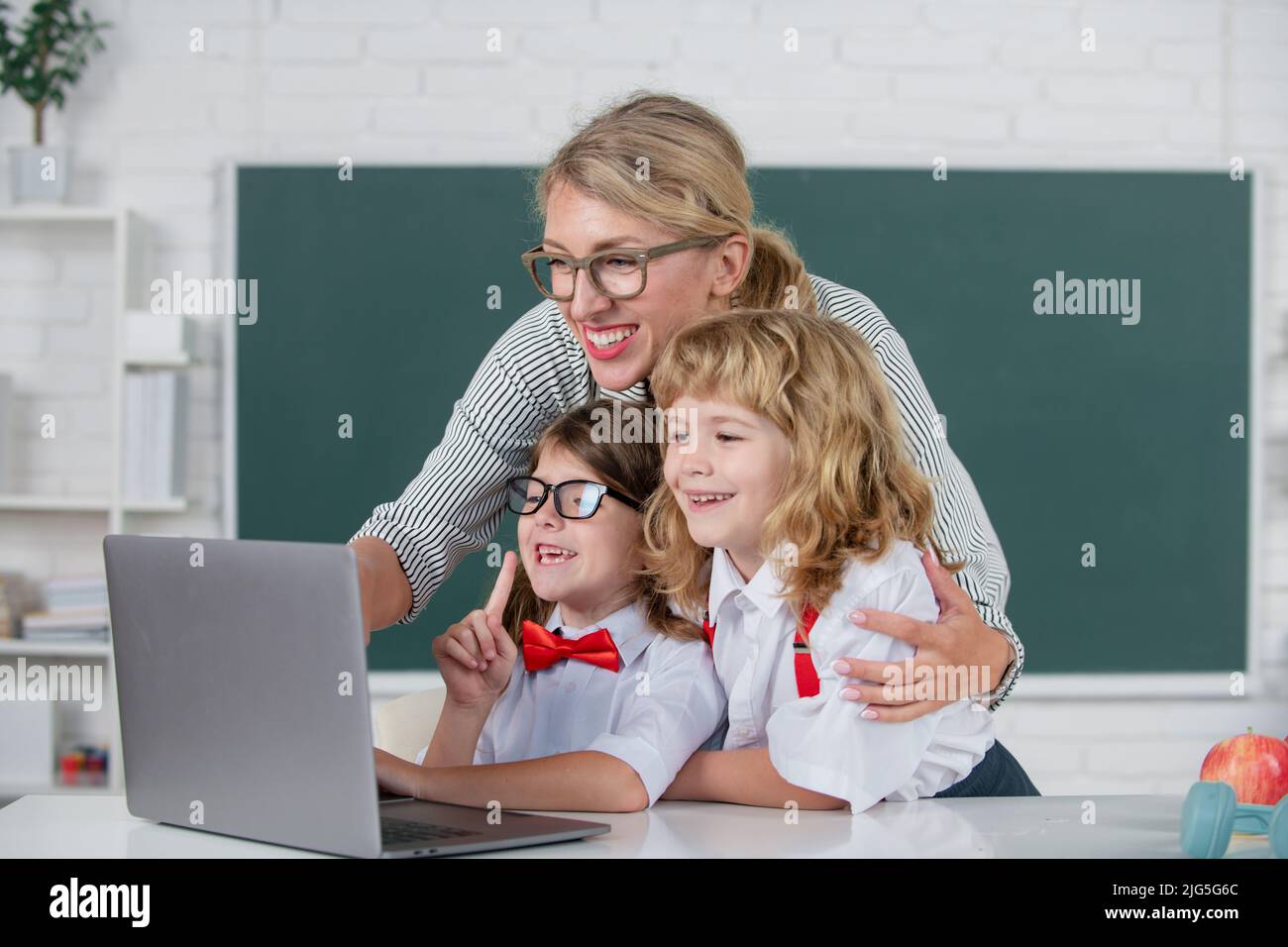 First day at school. Cute little boy from elementary school and tutor ...