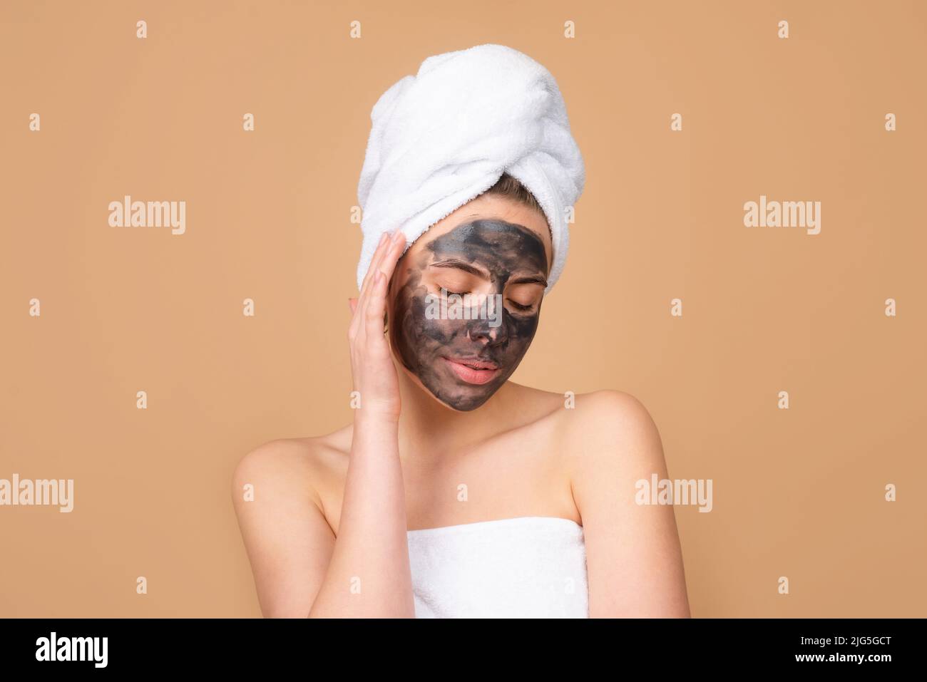 Beautiful girl with mud on his face. Cosmetic mask. Beauty face. Mud ...