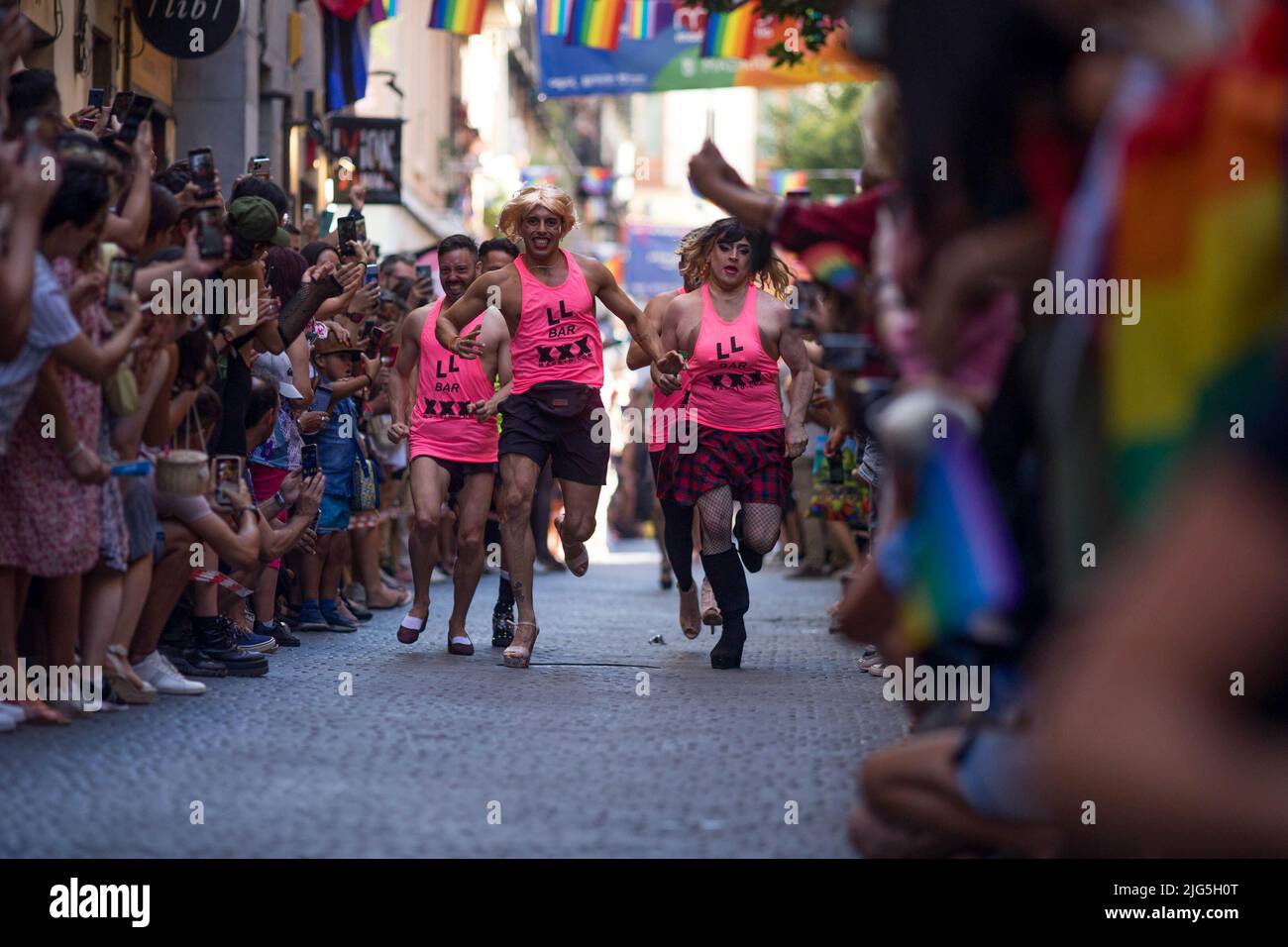 Participants wearing high heels compete at the high heels race, at the ...
