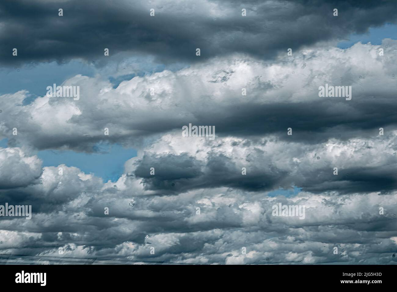 Summertime storm clouds loom overhead threatening rain and storms Stock ...