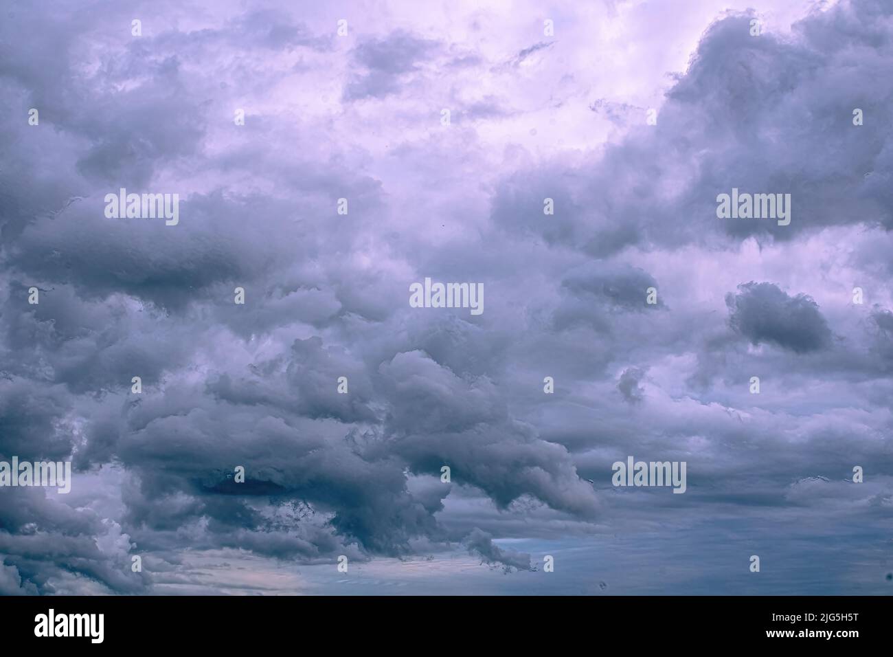 Summertime storm clouds loom overhead threatening rain and storms Stock ...