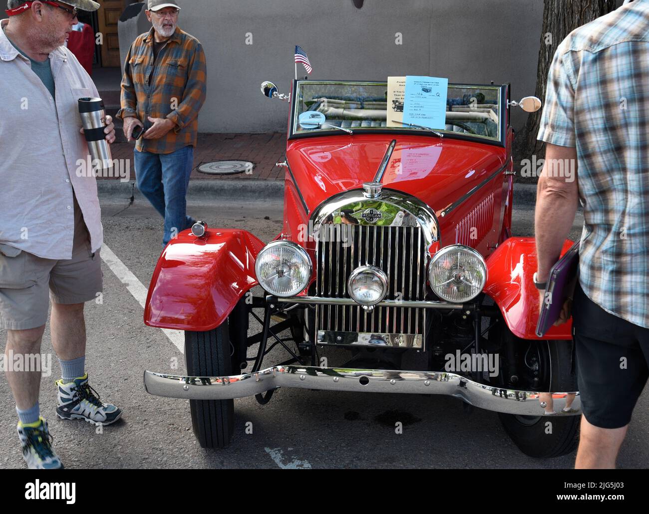 A rare English 1952 Morgan Plus 4 model on display at a car show in ...