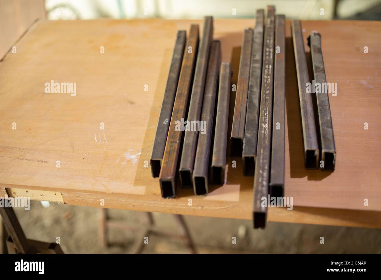 Steel billets. Sliced metal. Welding blanks. Irons in garage Stock ...